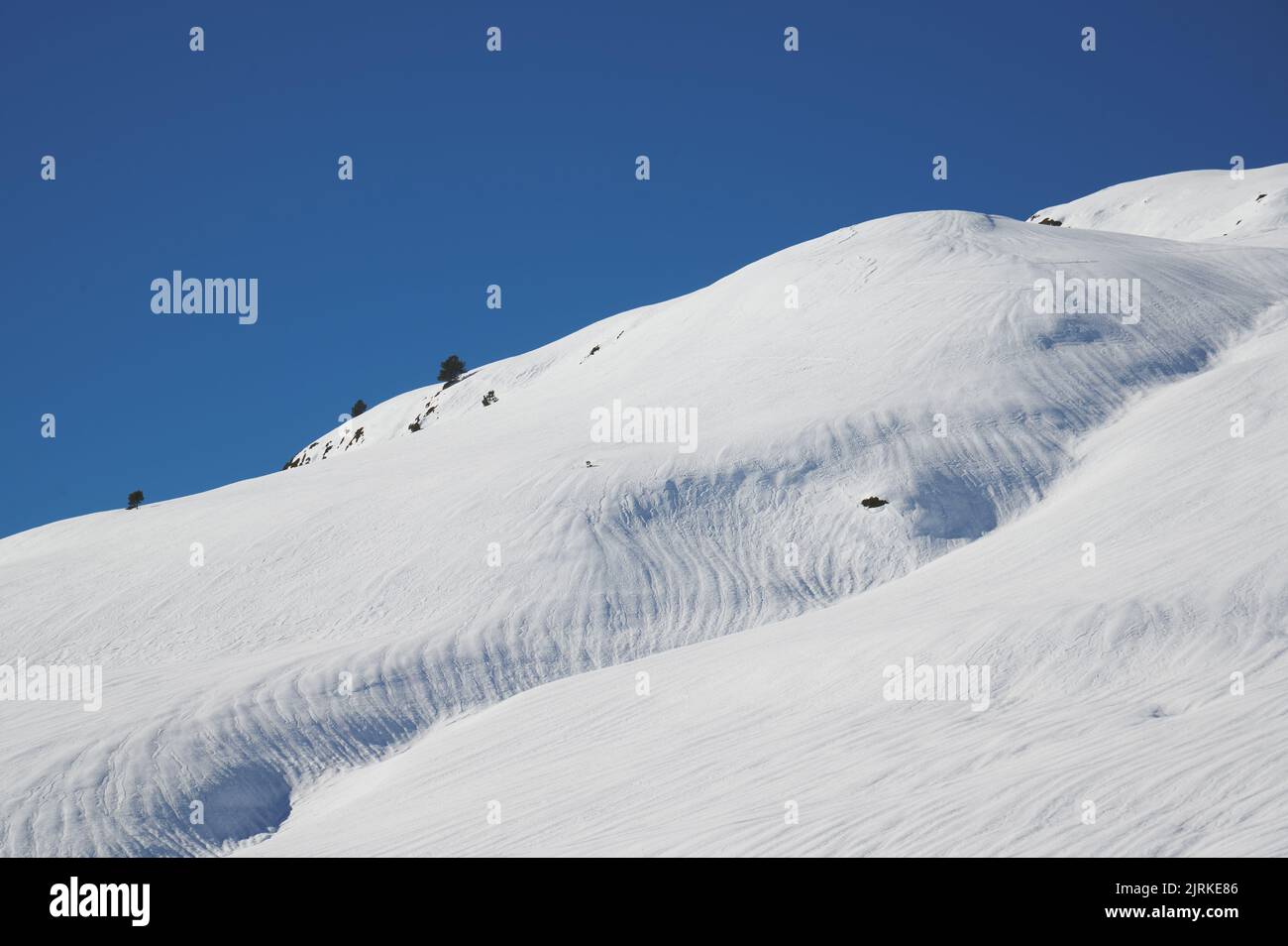 Hillside covered with snow in Pyrenees mountains located in Spanish ...