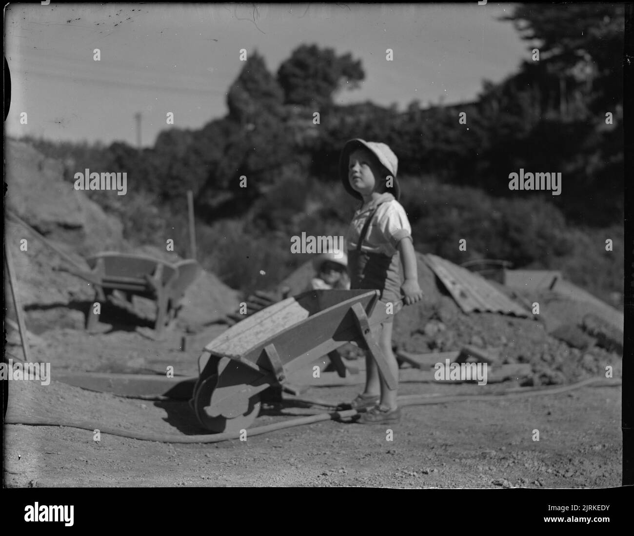 Child with a wheelbarrow, 1880-1925, New Zealand, maker unknown Stock ...
