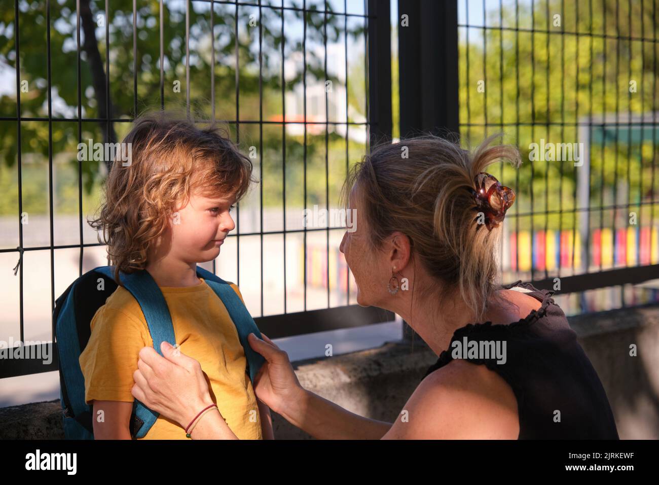 Mother saying goodbye to son in front of school Stock Photo - Alamy