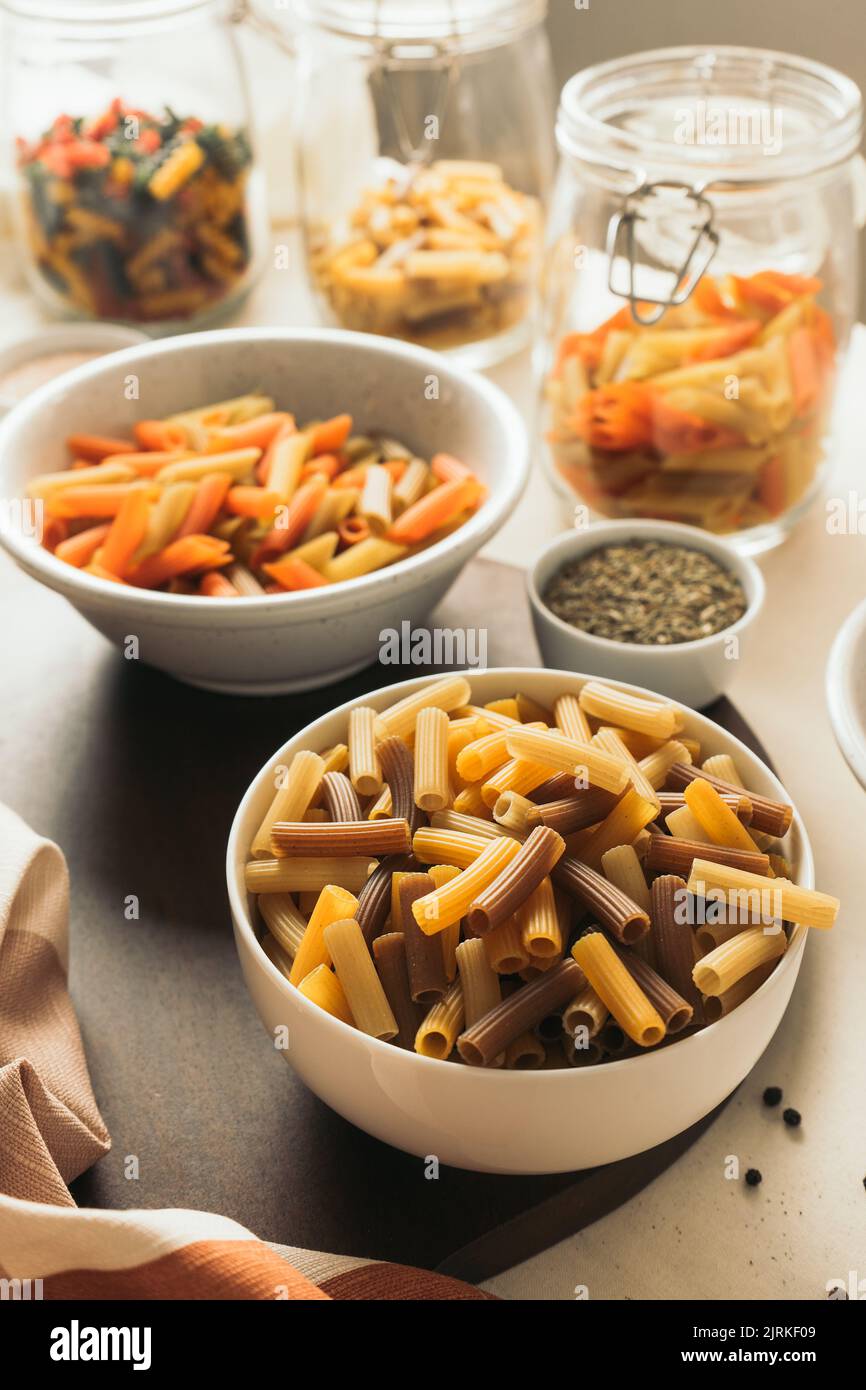 Different macaroni in bowls Stock Photo - Alamy