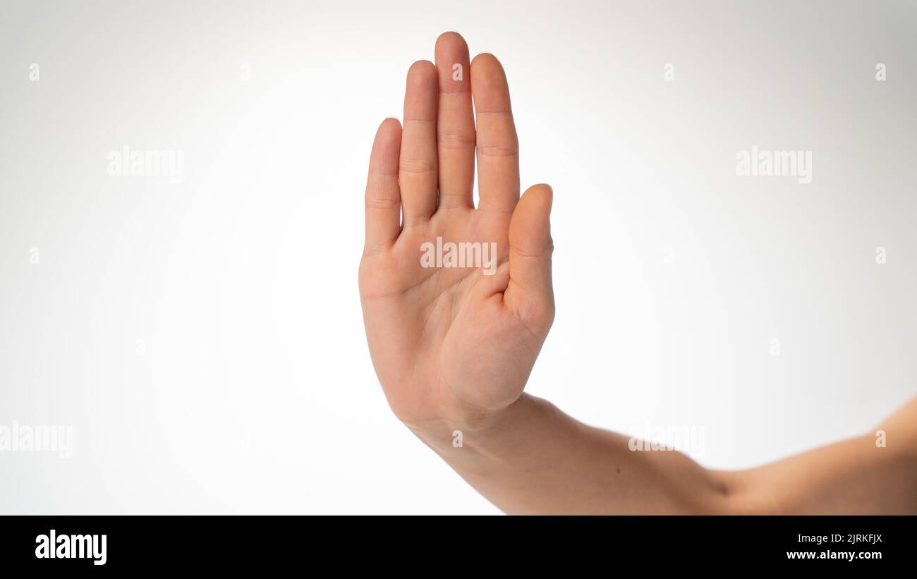 woman's hand gesture stop on a white background Stock Photo - Alamy