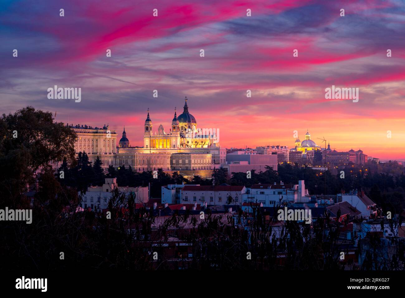 Palacio real historical building of Madrid and empty illuminated street ...