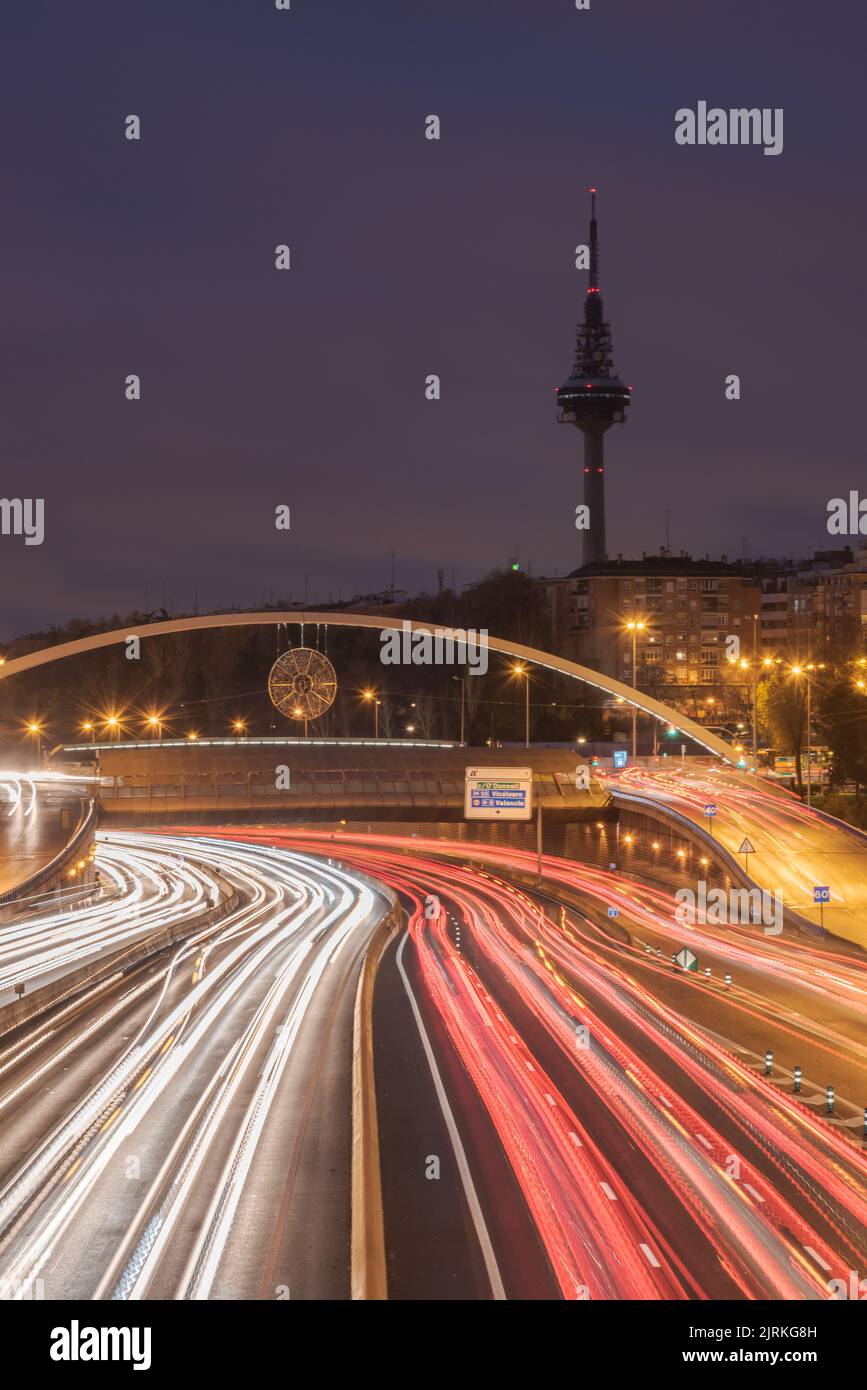 Amazing view of red and white traffic light trails along road in night ...