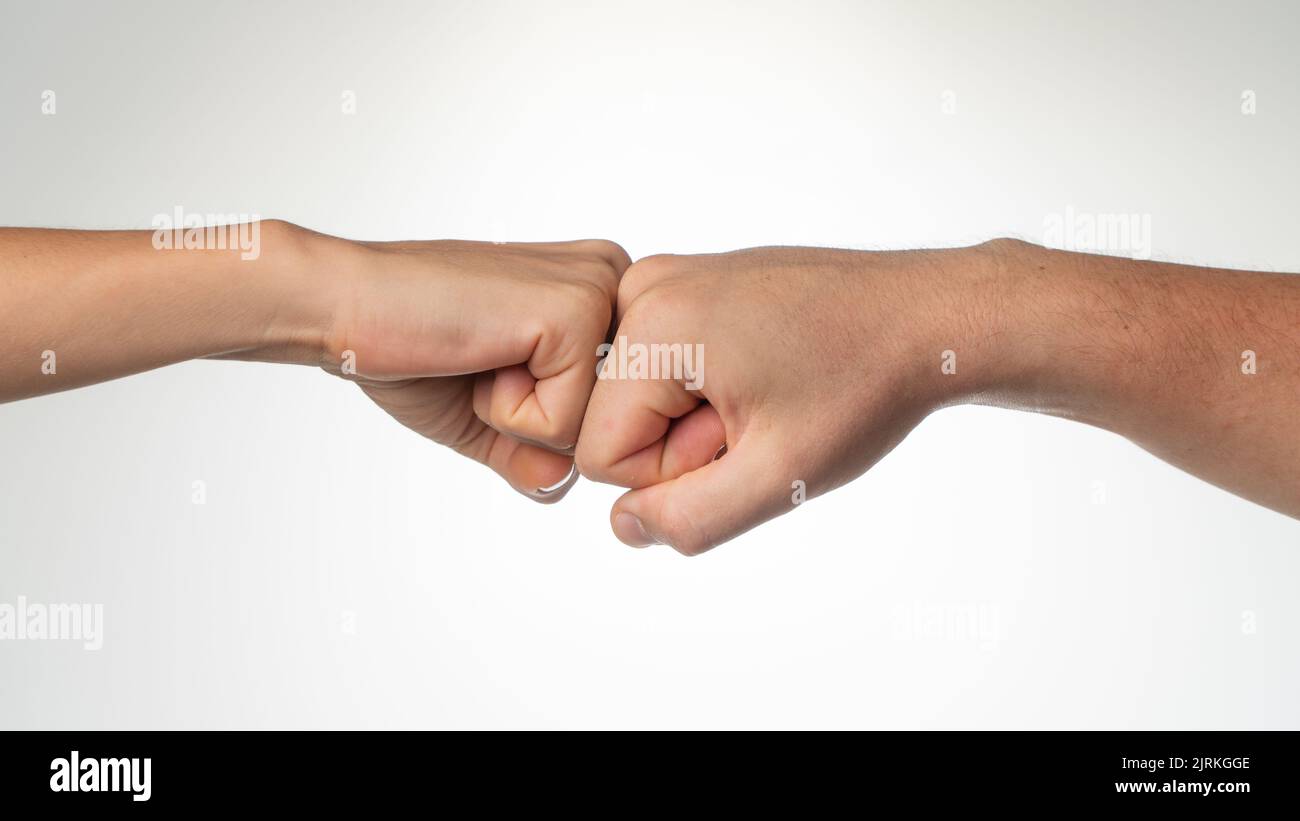 Two fists together gesture greeting friends bro Stock Photo - Alamy