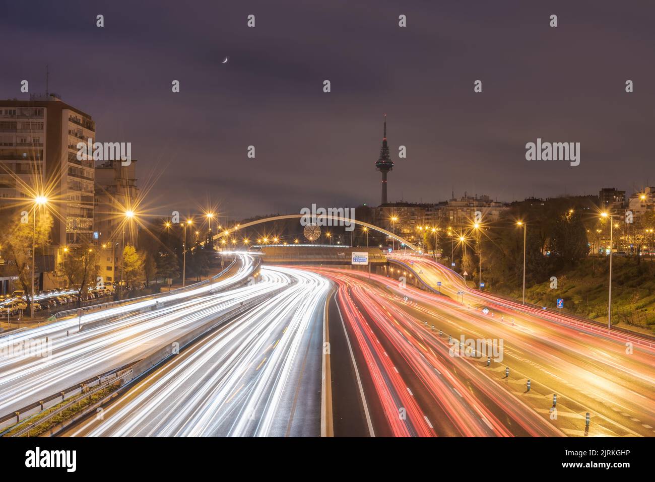 Amazing view of red and white traffic light trails along road in night ...