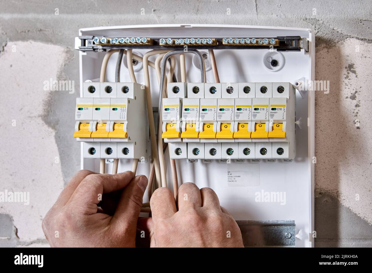 Installation of new consumer unit of switchboard with circuit breakers ...