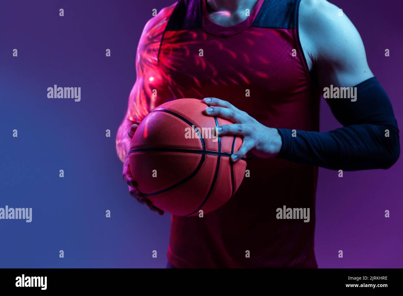 Creative studio shot of basketball player in the studio using color ...