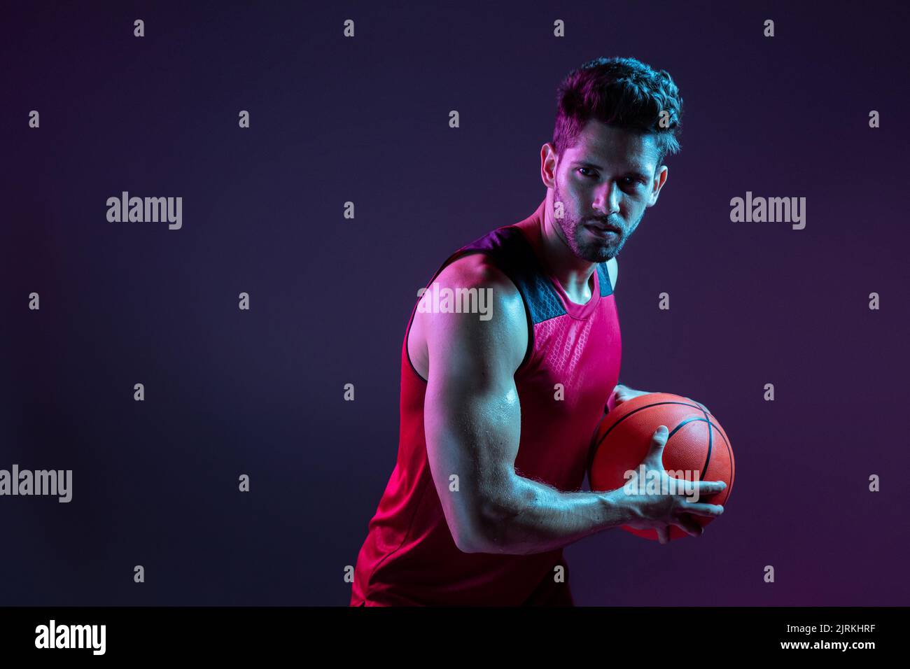 Creative studio shot of basketball player in the studio using color ...