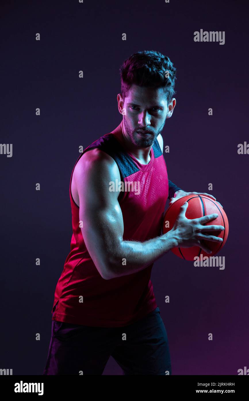 Creative studio shot of basketball player in the studio using color ...