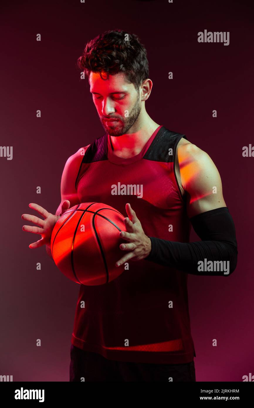 Creative studio shot of basketball player in the studio using color ...