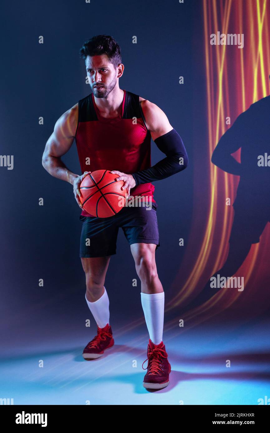 Creative studio shot of basketball player in the studio using color ...
