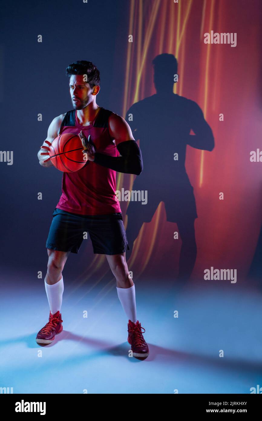 Creative studio shot of basketball player in the studio using color ...