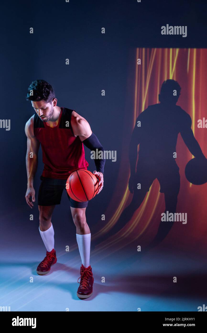 Creative studio shot of basketball player in the studio using color ...