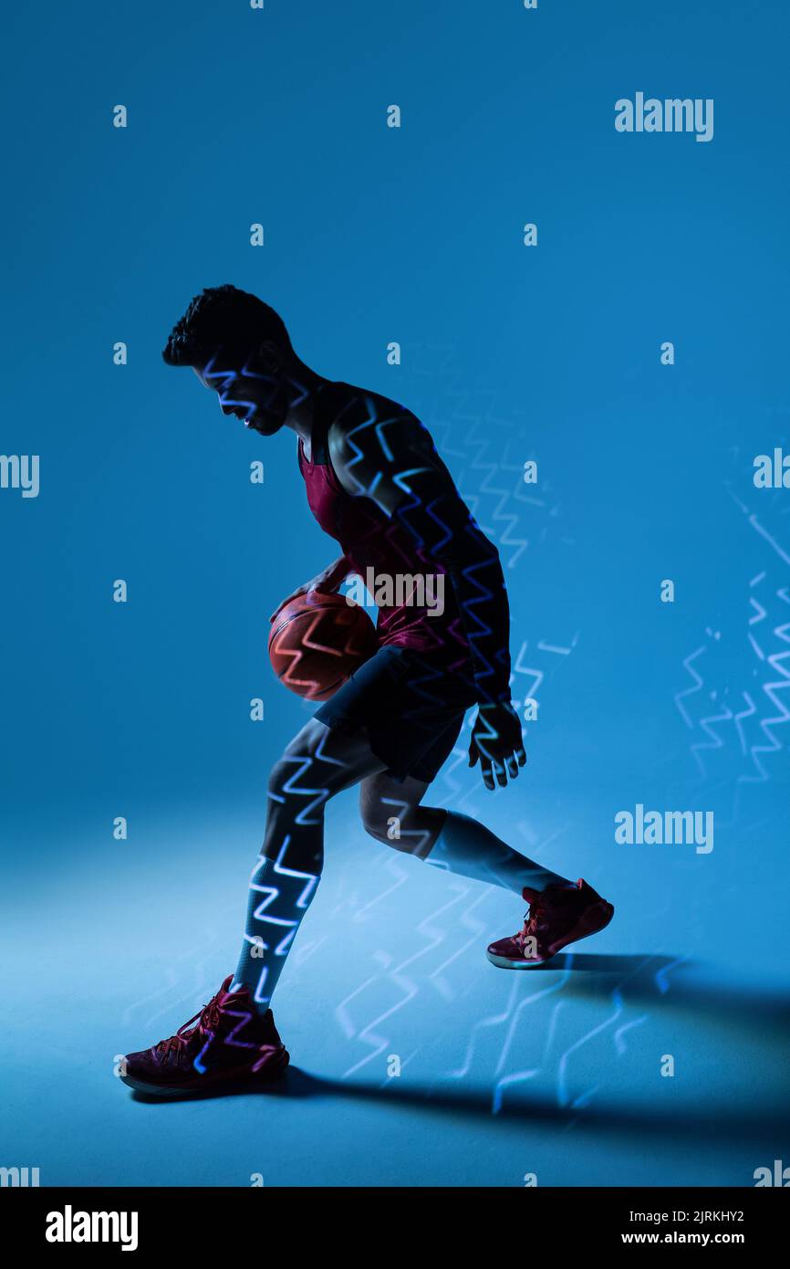 Creative studio shot of basketball player in the studio using color ...