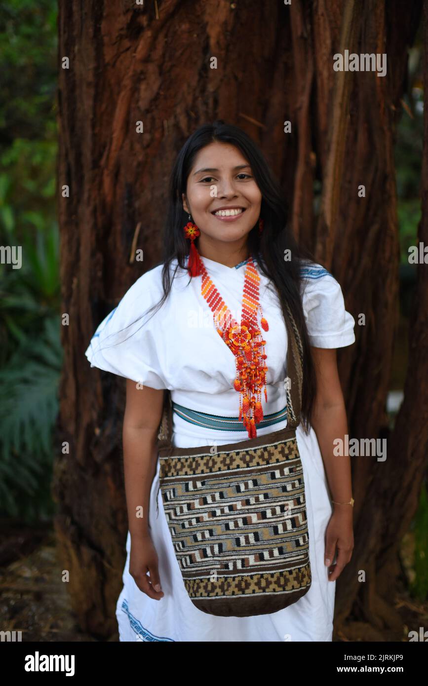 Portrait of a happy young Arhuaco indigenous woman in a forest of ...