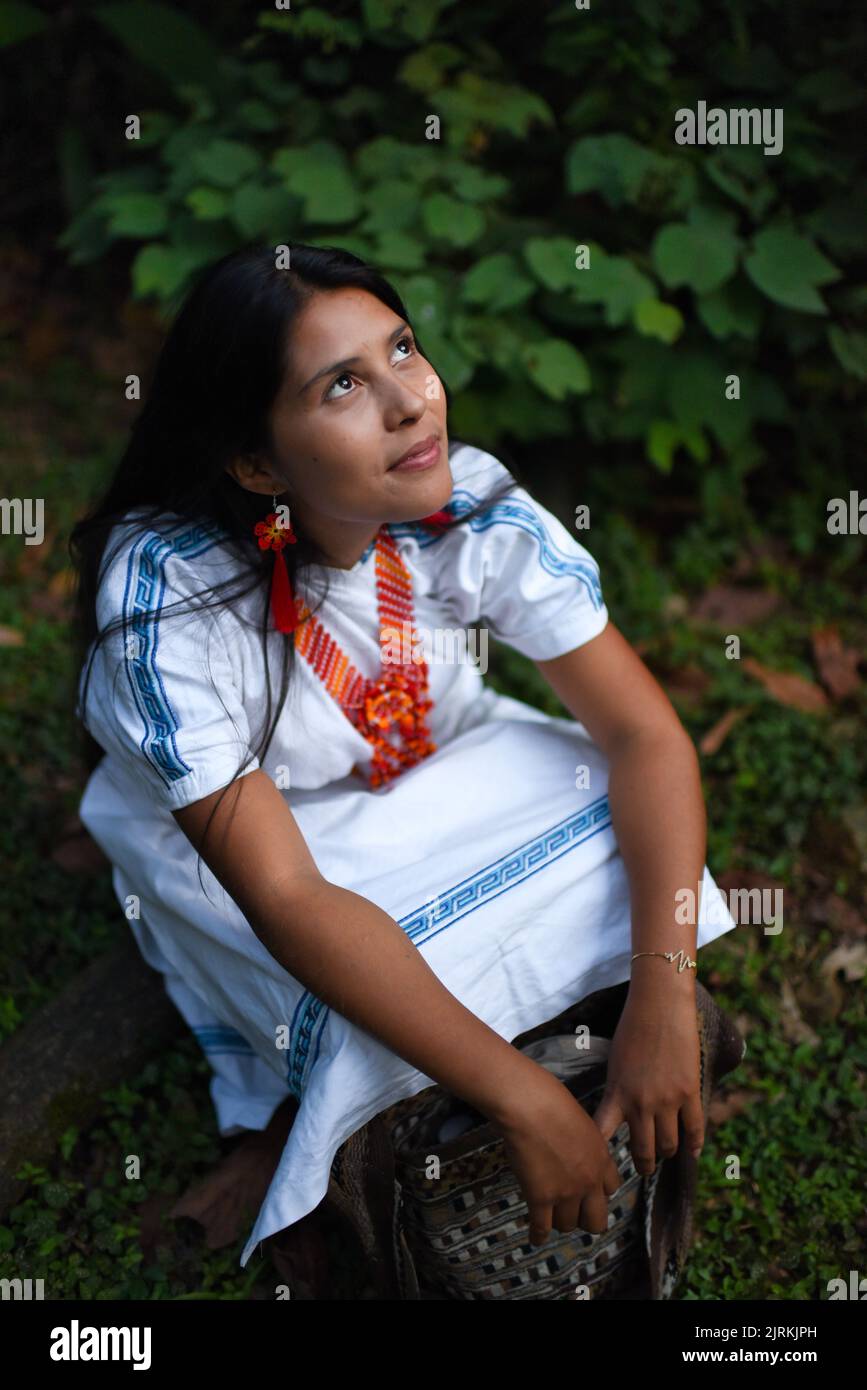 Portrait of contemplative and dreamy young Arhuaco indigenous woman in ...
