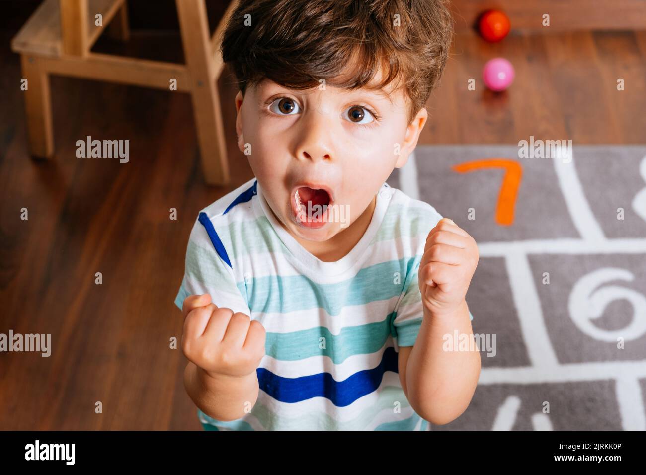 Boy clenching fist hi-res stock photography and images - Alamy