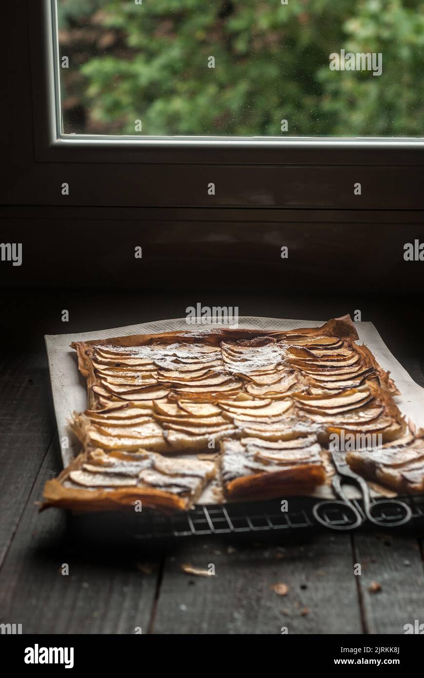 Delicious baked apple pie with frangipane cut into pieces and composed ...