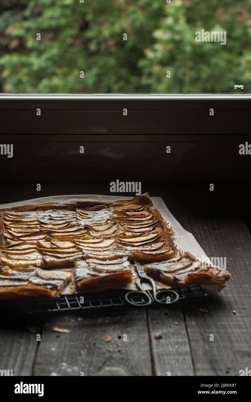 Delicious baked apple pie with frangipane cut into pieces and composed ...