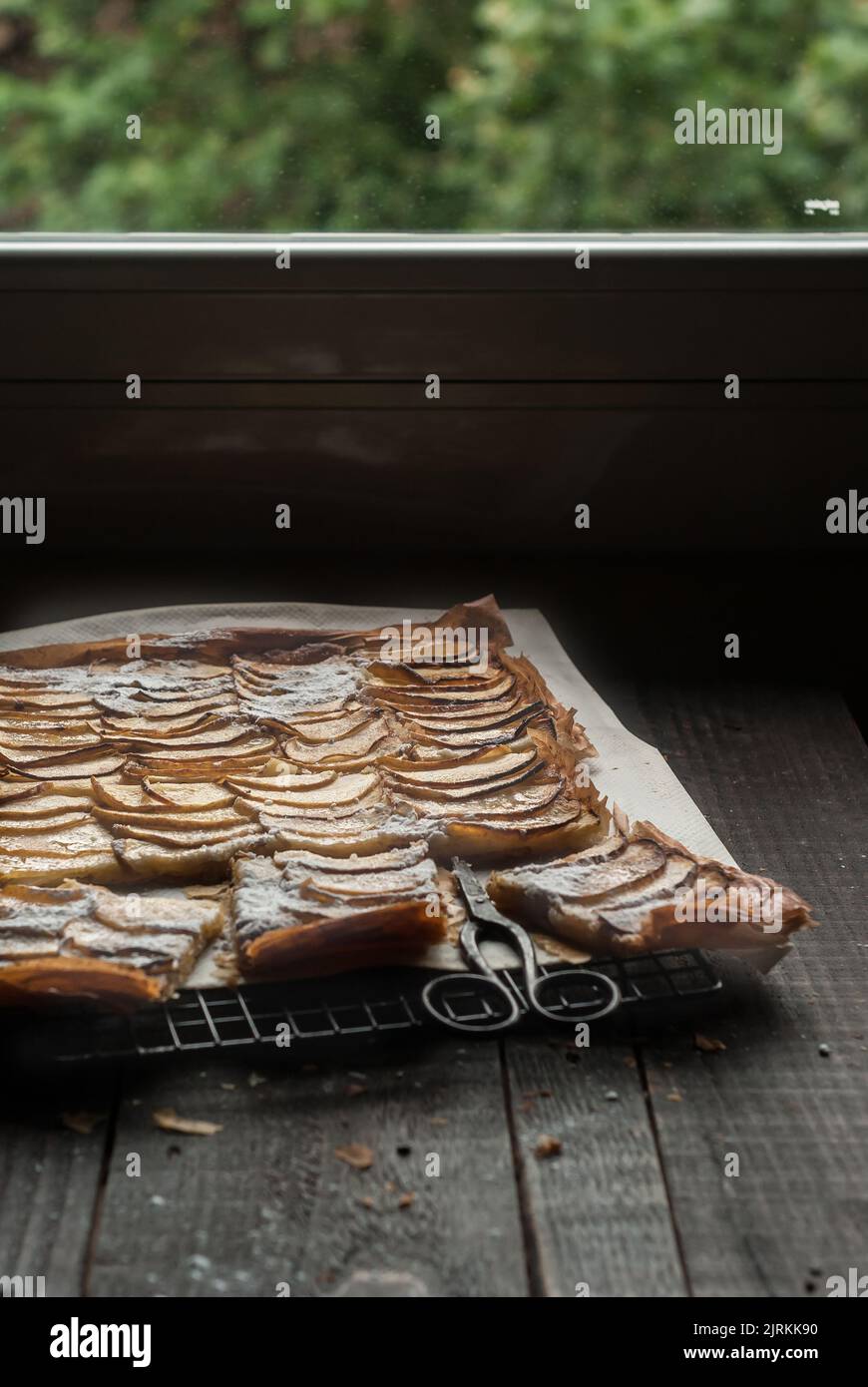 Delicious baked apple pie with frangipane cut into pieces and composed ...