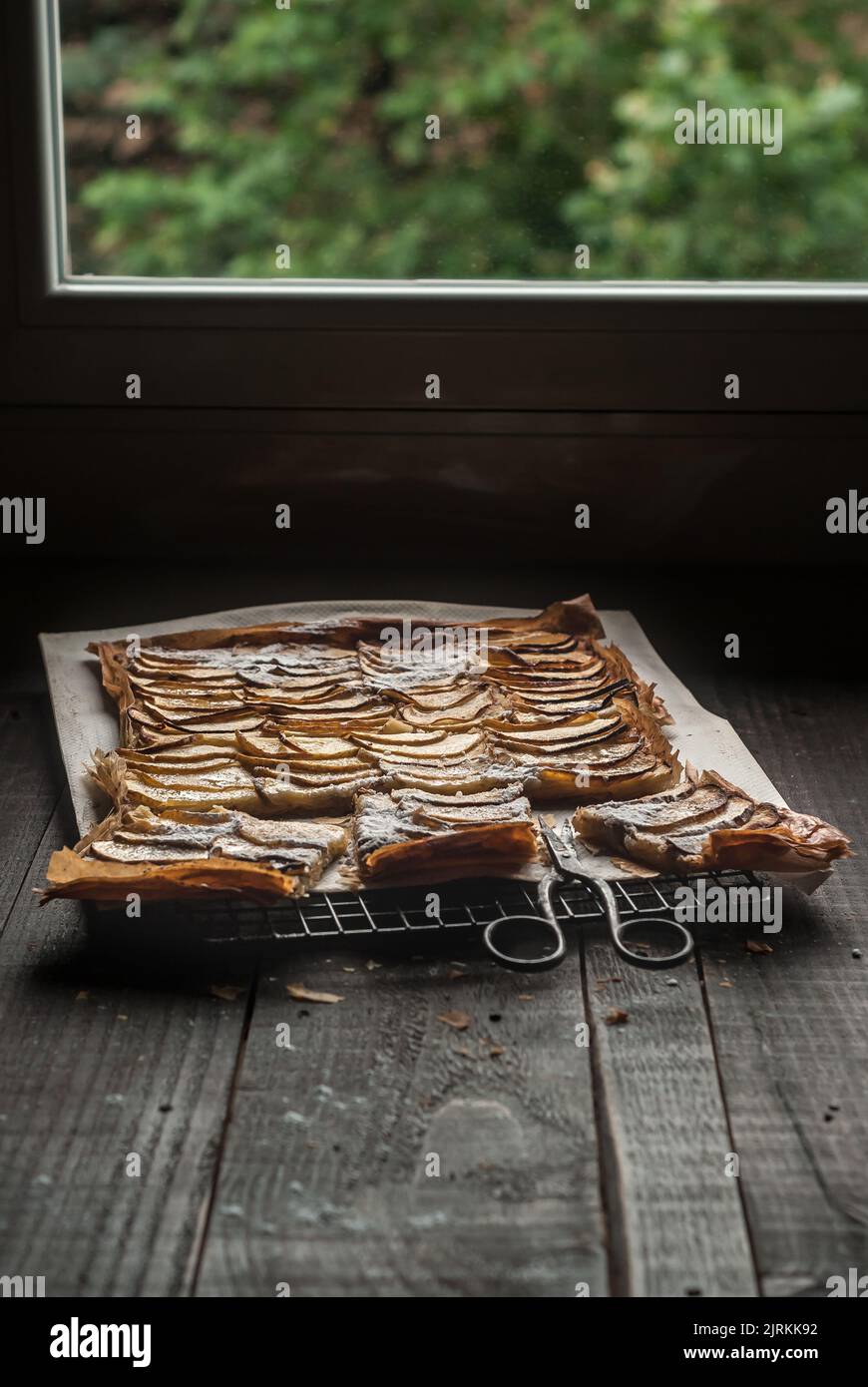 Delicious baked apple pie with frangipane cut into pieces and composed ...
