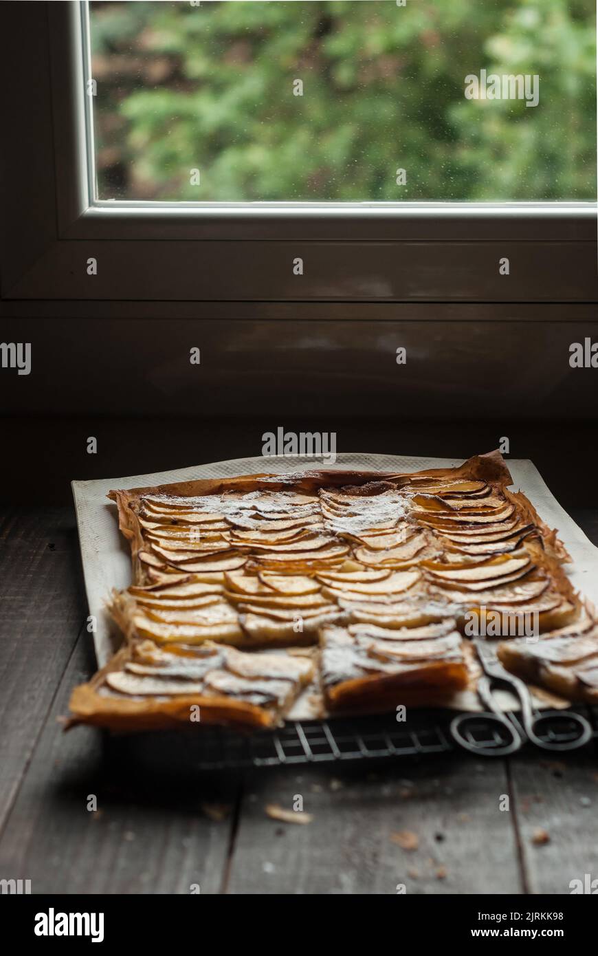 Delicious baked apple pie with frangipane cut into pieces and composed ...