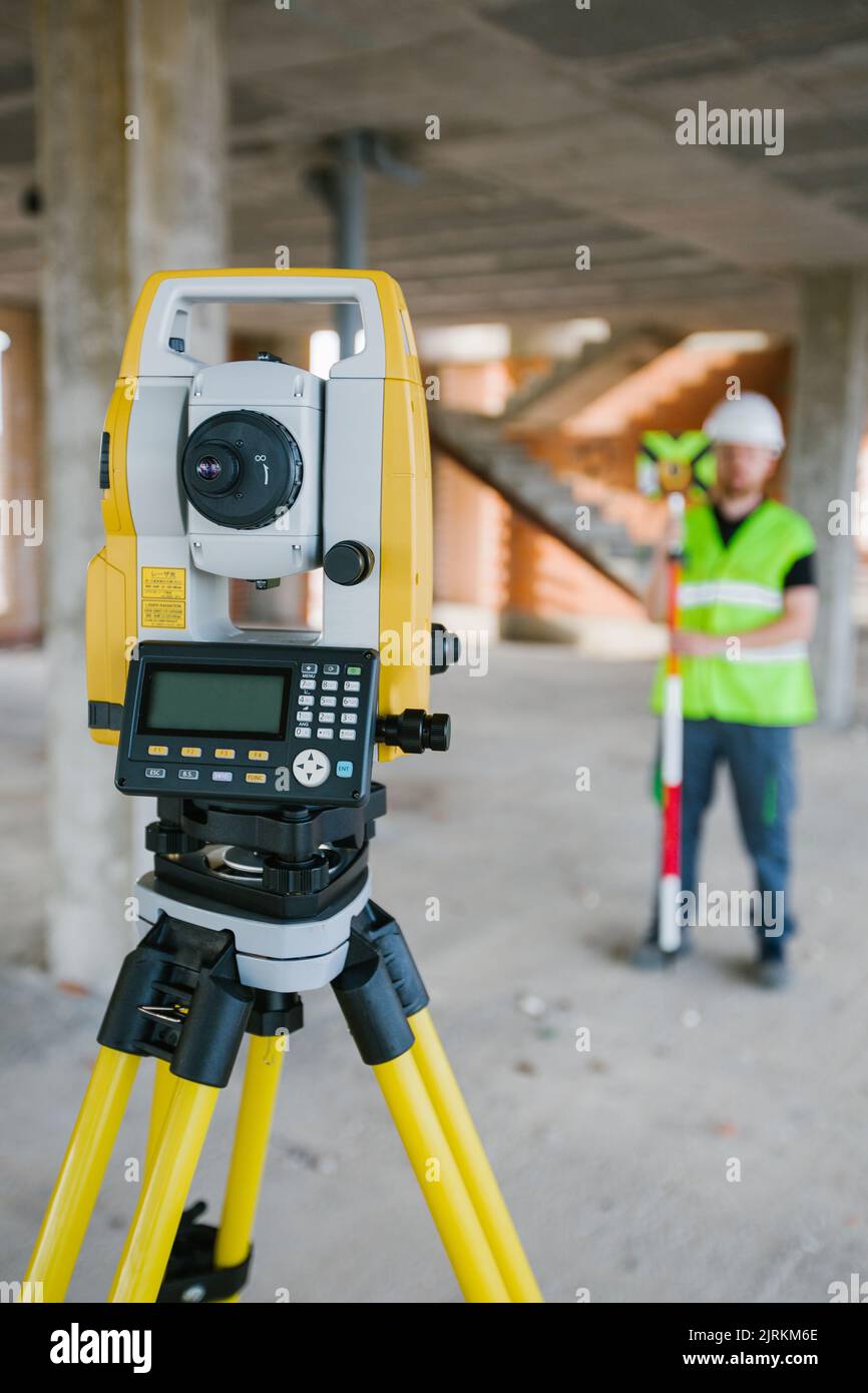 Measuring equipment (total station) at construction site prepared for ...