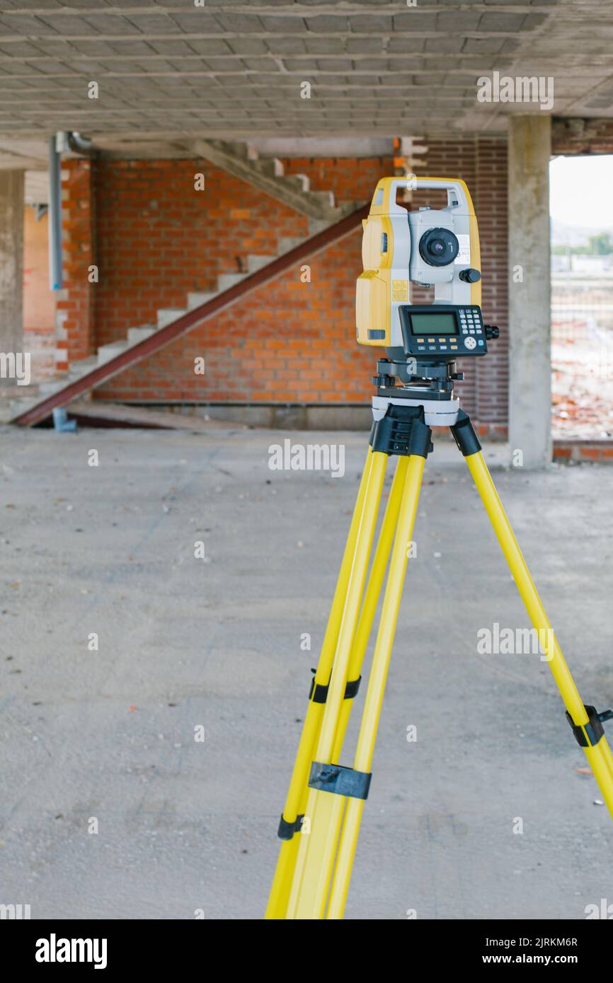 Measuring equipment (total station) at construction site prepared for ...