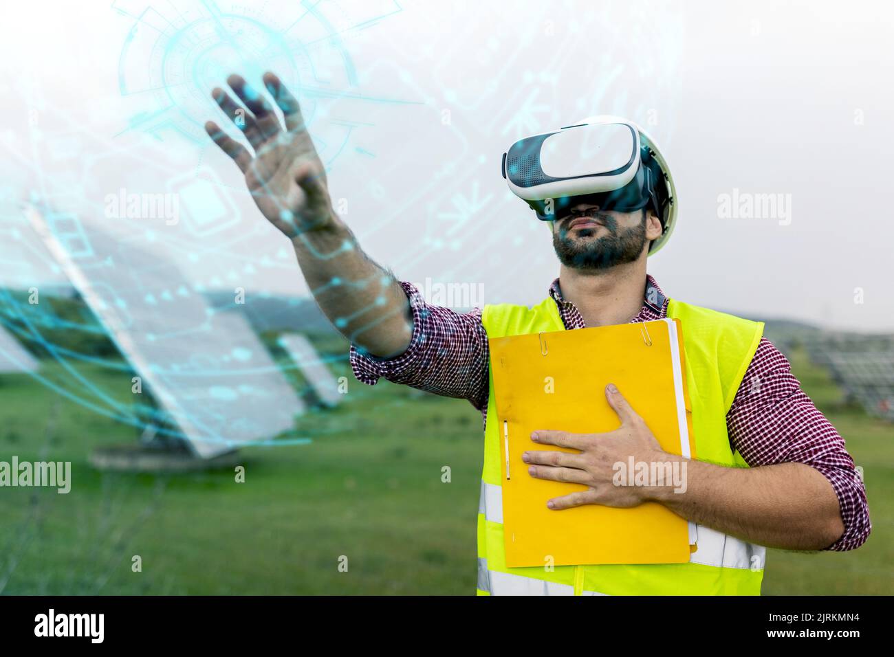 Man in VR headset interacting with virtual scheme while working on ...