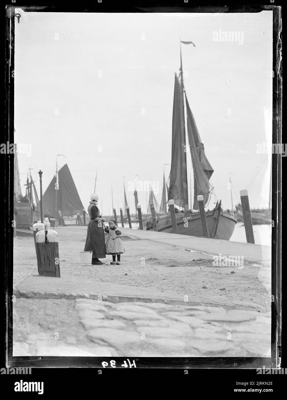 Woman and girl on waterfront, the Netherlands, 1906-1917, Netherlands, by George Crombie Stock ...