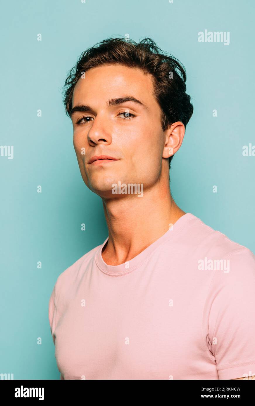 close-up young glad male in t shirt with brown hair with half-open eyes ...