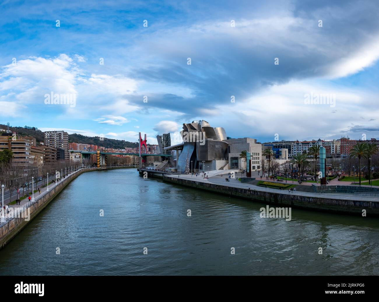 Guggenheim Museum in Bilbao, Basque Country, Spain under a cloudy sky ...