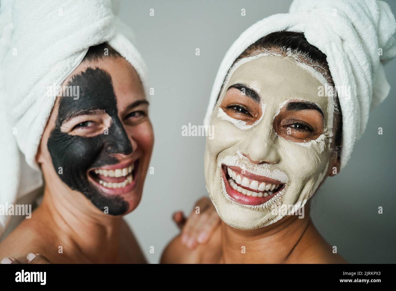 Senior women doing beauty treatment using beauty skin masks - Focus on ...