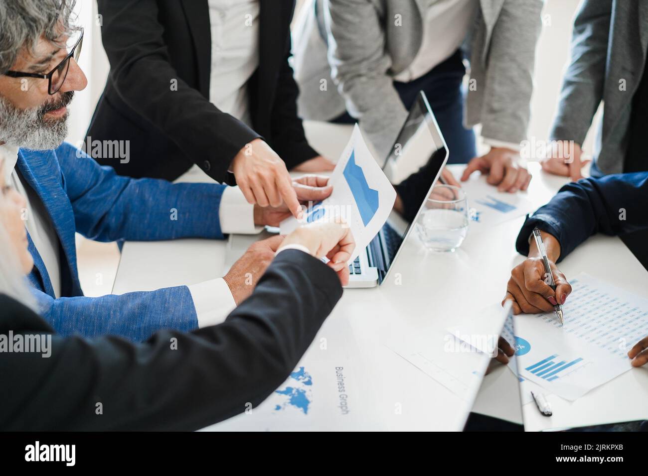 Multiracial business people working inside bank office - Focus on right ...