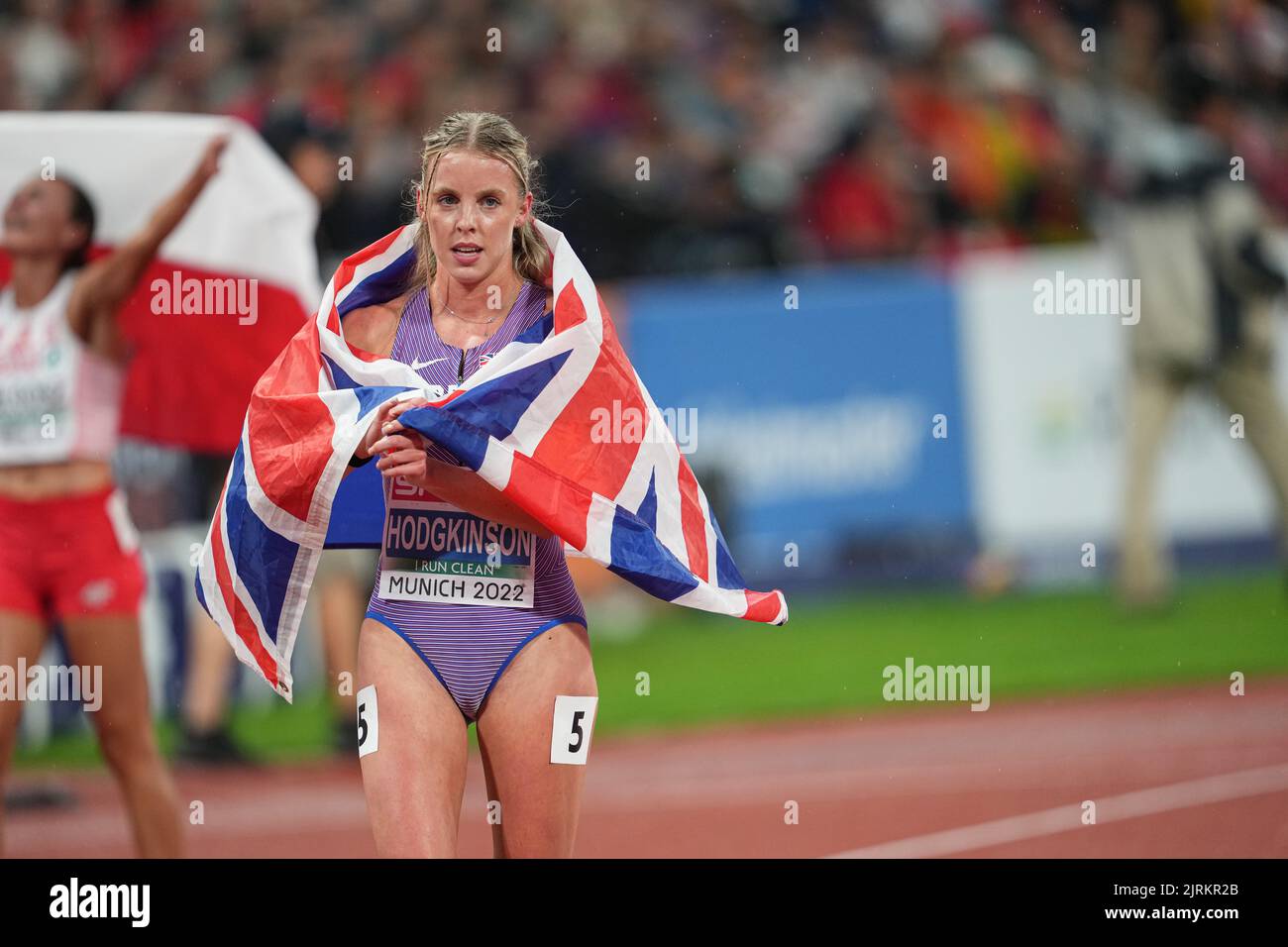 Keely Hodgkinson with the English flag as the winner of the 800 meters ...