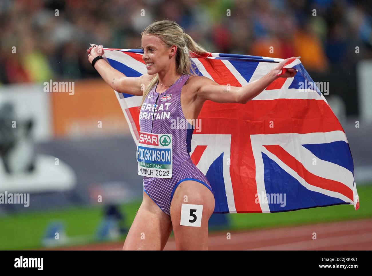 Keely Hodgkinson with the English flag as the winner of the 800 meters ...