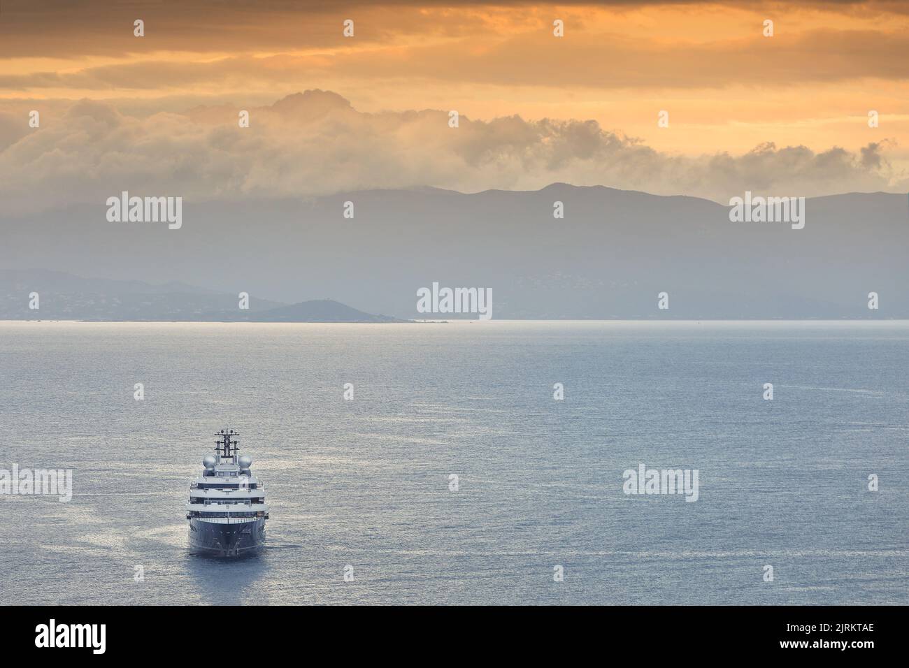 Luxury motor yacht on the ocean at sunset. A large private motor yacht ...