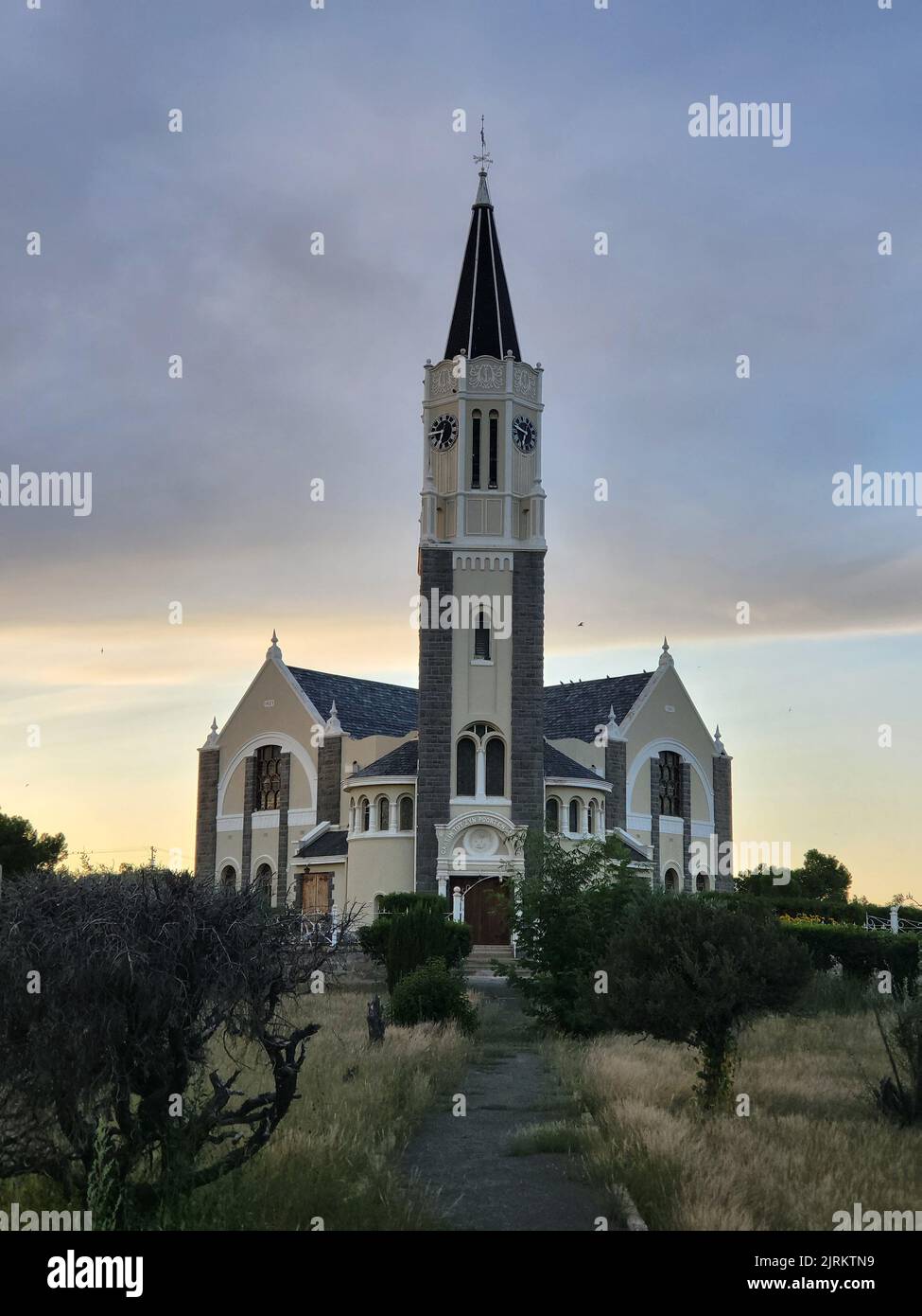 A tall chapel church with sunset background Stock Photo - Alamy