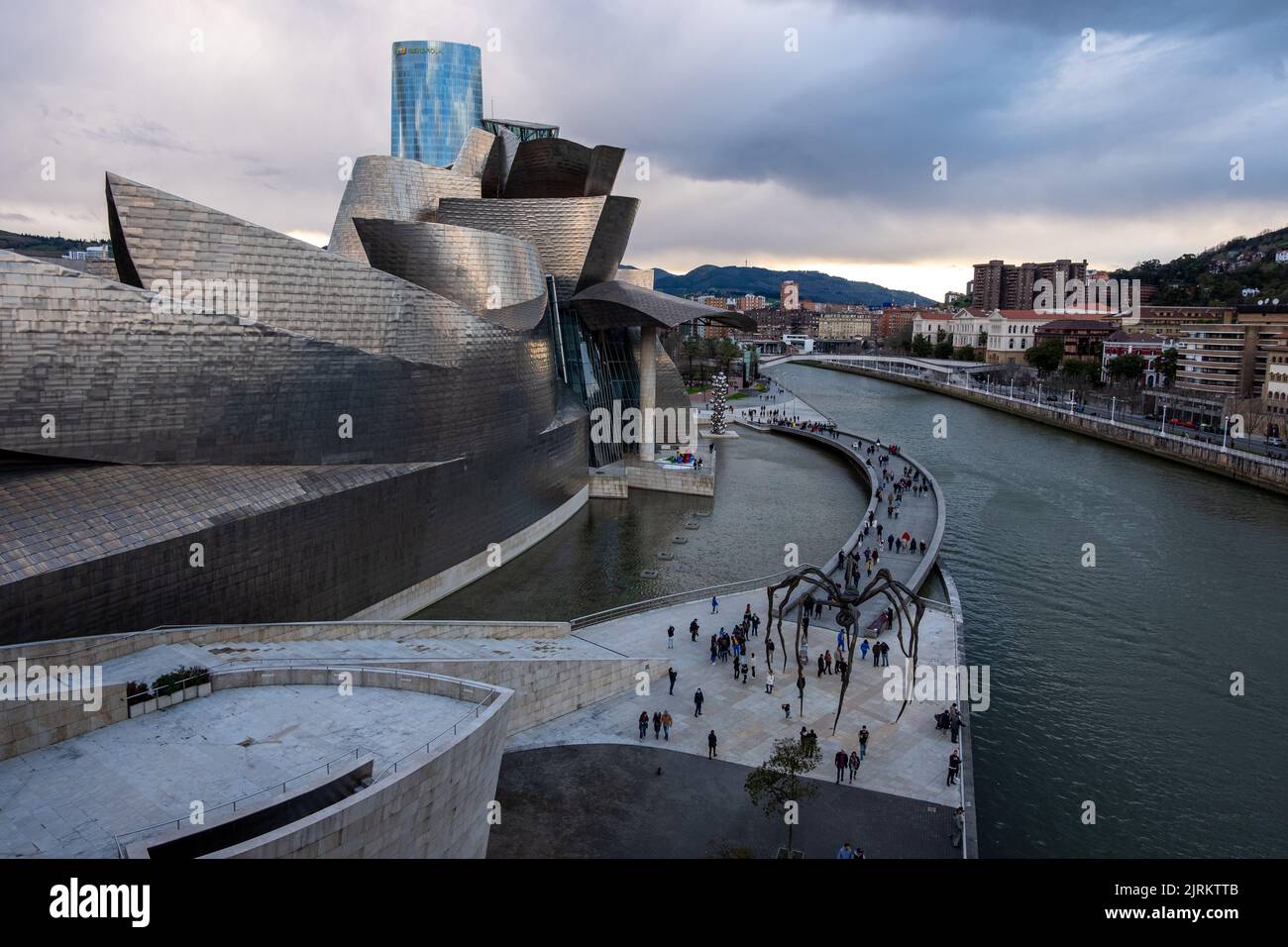 Guggenheim Museum in Bilbao, Basque Country, Spain under a cloudy sky ...