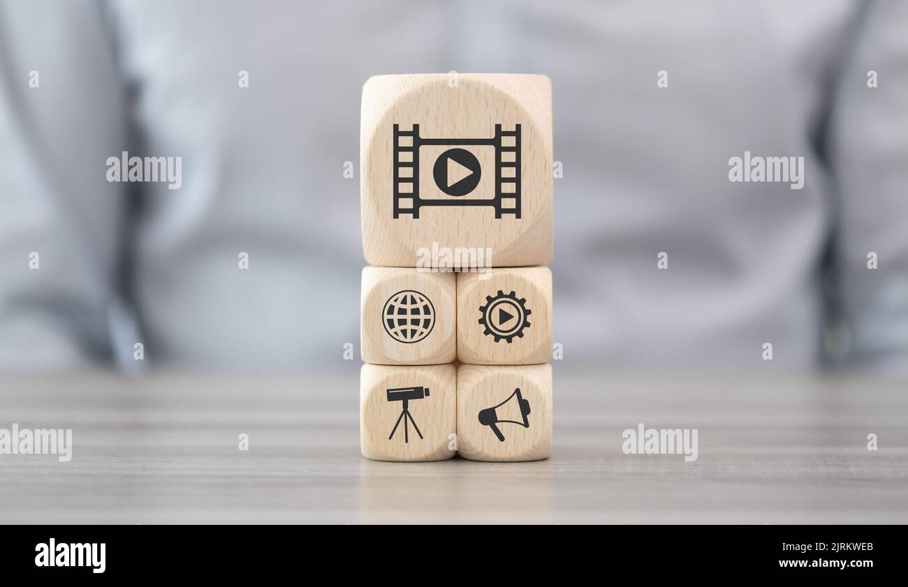 Wooden blocks with symbol of cinema concept Stock Photo - Alamy
