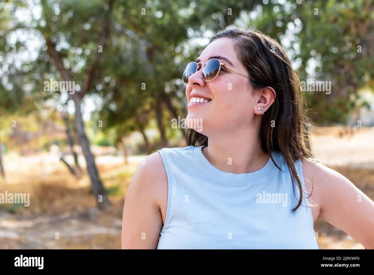 A side view portrait of a caucasian woman smiling Stock Photo - Alamy