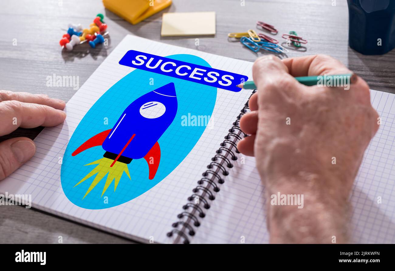 Hand drawing success concept on a notepad Stock Photo - Alamy