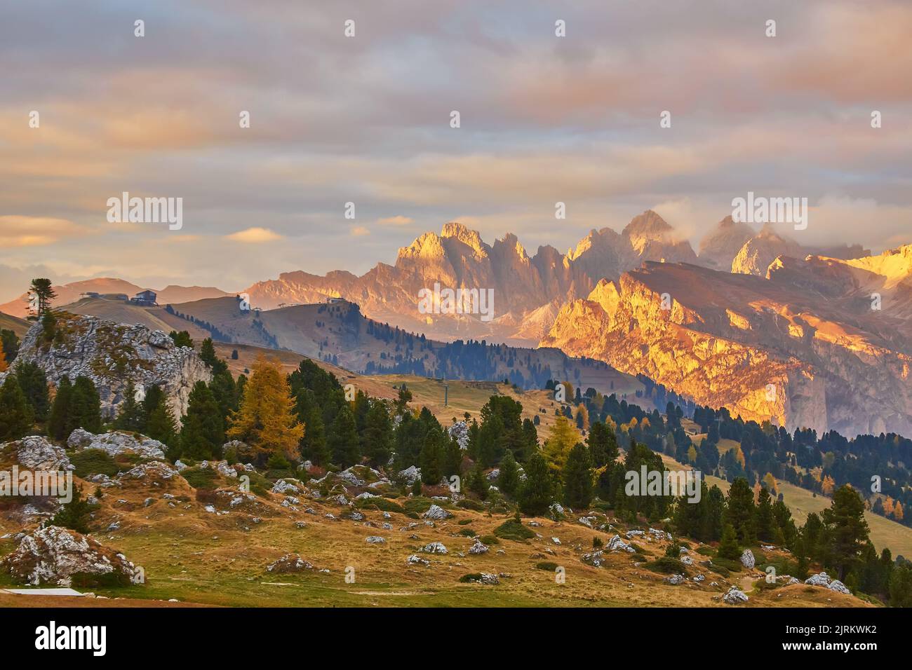 Aerial autumn sunrise scenery with yellow larches and small alpine ...