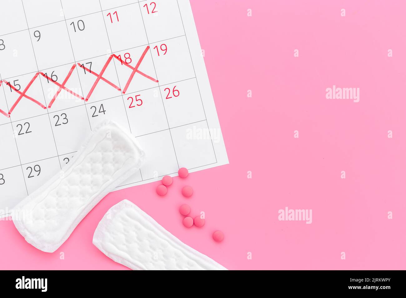 Calendar with red marks and white pad. Menstruation period concept ...