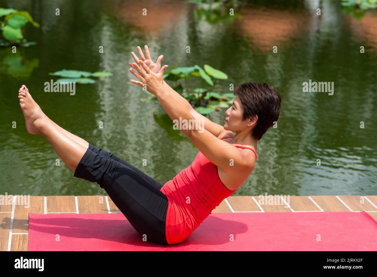 Japanese yogi doing exercise for her abs Stock Photo - Alamy