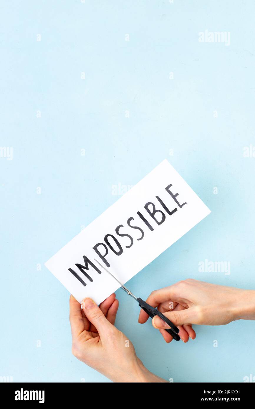 Paper card Impossible change into Possible with scissors Stock Photo ...