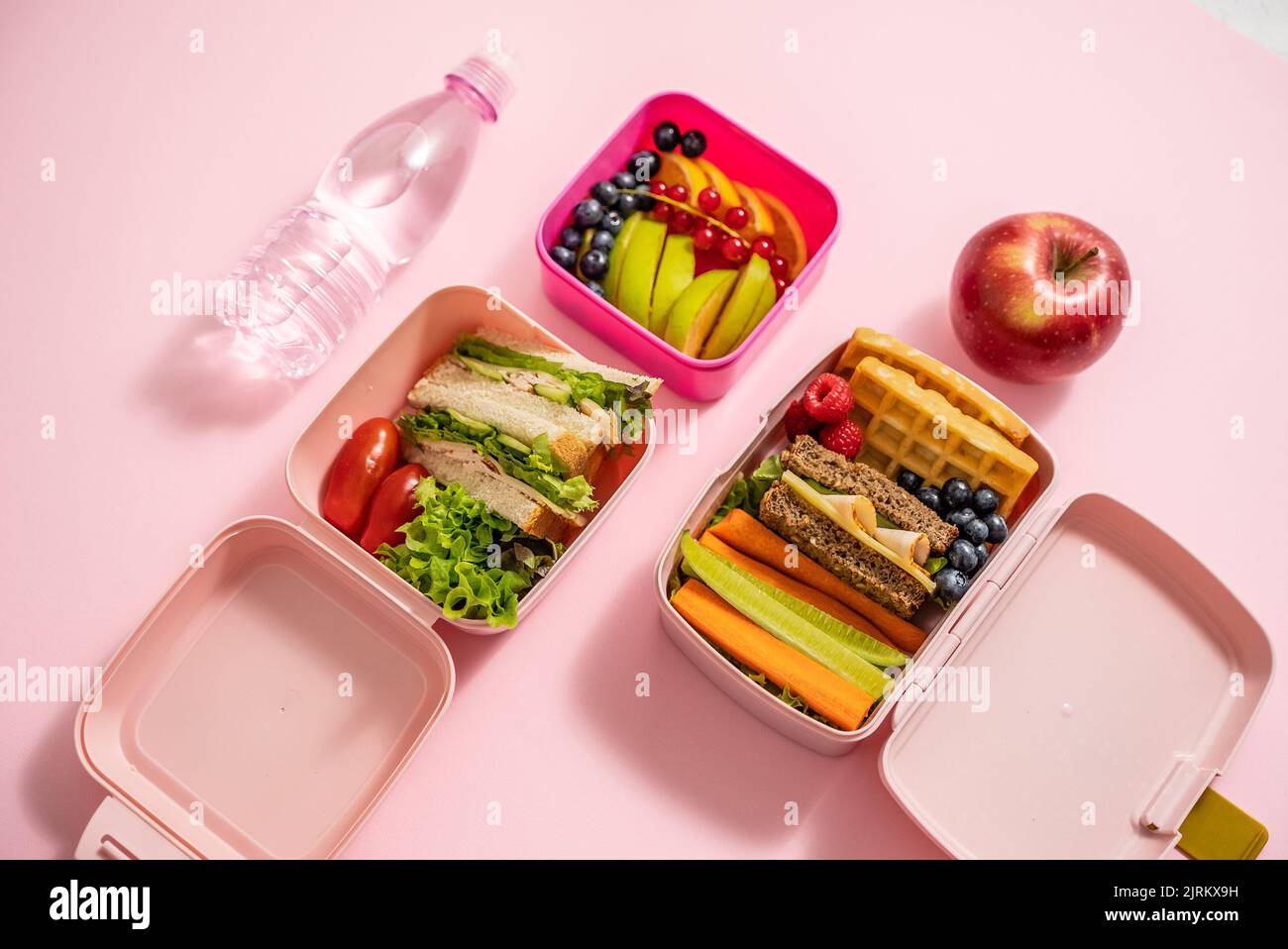 Healthy lunch to go. Sandwitches, Fruits and vegetables packed in lunch ...