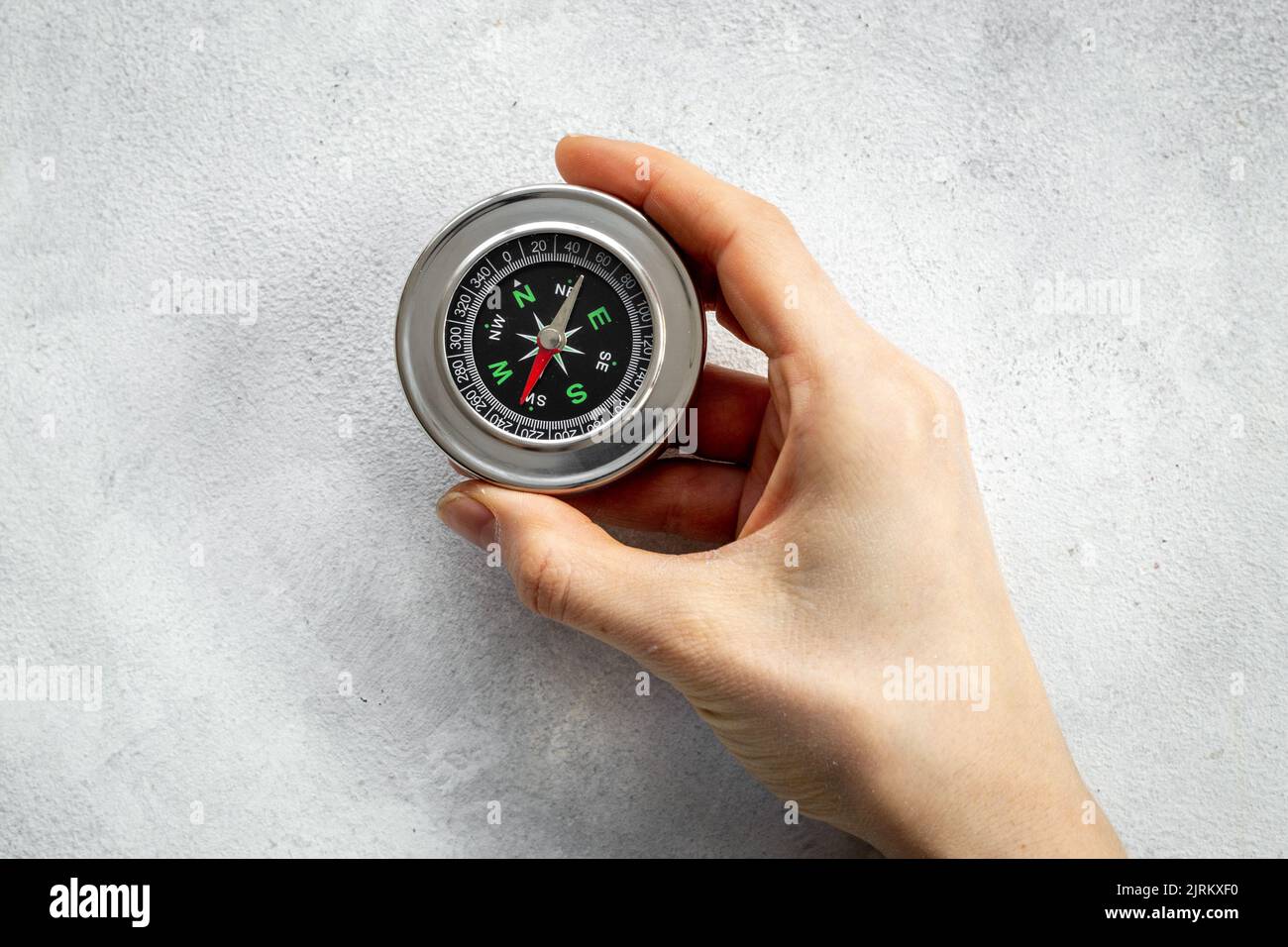 Compass in businessmans hand. Business navigates recovery concept Stock ...