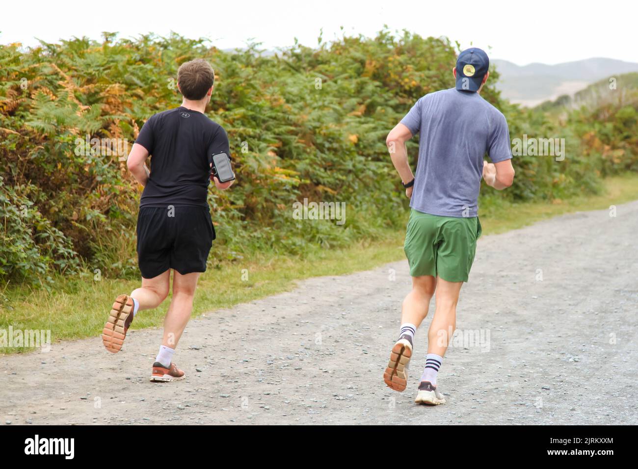 2 male runners from behind, Woolacombe Dunes Park Run, North Devon ...