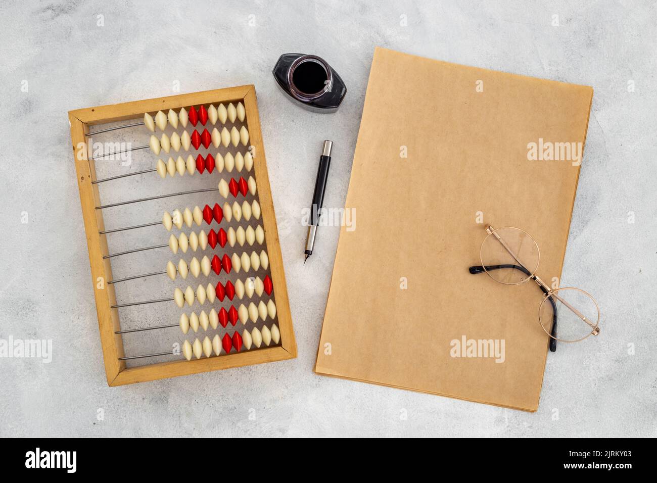 Accounting wooden abacus with blank sheet of paper. Financial ...